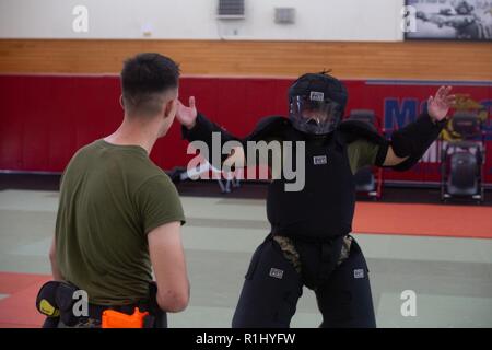 U.S. Marine Corps Cpl. Edgar R. Huff drills a platoon of recruits at ...