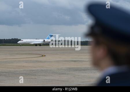 Col. Mary Teeter, 89th Maintenance Group commander, renders a salute as ...