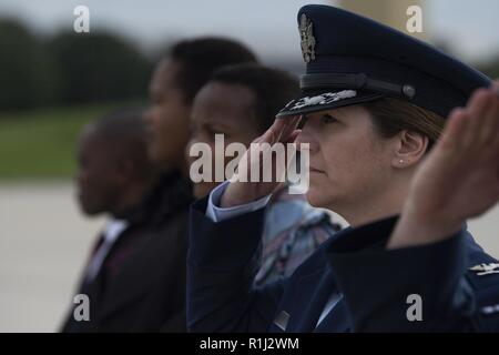 Col. Mary Teeter, 89th Maintenance Group commander, renders a salute as ...