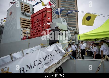 HMCS Moncton (MM 708) coastal defence vessel sails past the Westin Nova ...