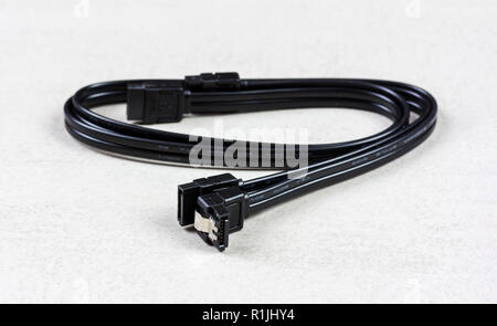 black computer cable SATA 6Gbs isolated on white background closeup top ...