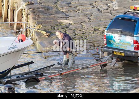 New Quay,UK,13th November 2018, UK Weather: A 4x4 vehicle helps pull a ...