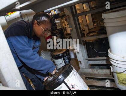U.S. Navy Seaman organizes hazardous materials receipts aboard the ...