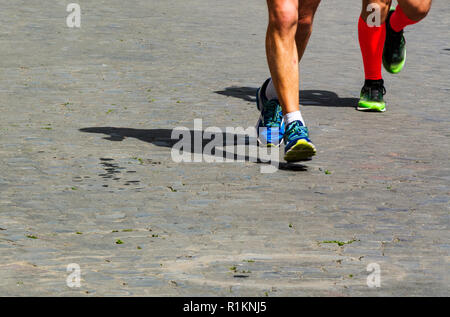 Marathon running race, people feet on city road Stock Photo - Alamy