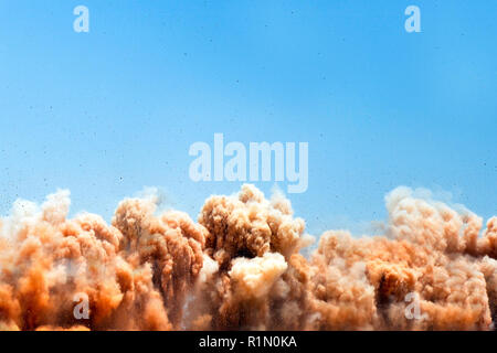 Dust clouds after powerful detonator blast on the mining site Stock ...