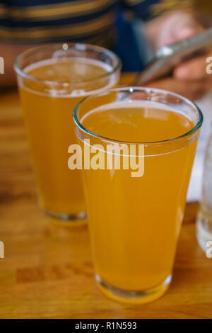 Glasses of beer on table in winter Stock Photo - Alamy