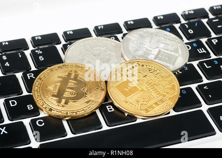 Bitcoin coins on laptop keyboard. Cryptocurrency concept Stock Photo ...