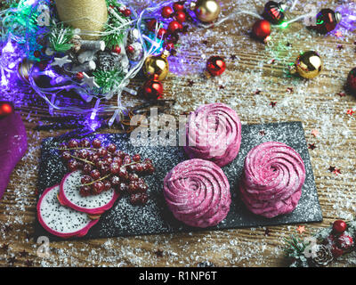 Red currant marshmallow, handmade. A cup of coffee with dessert on the ...