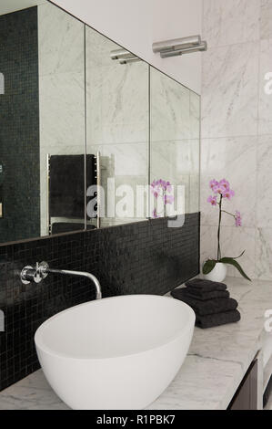 Modern washbasin with mixer tap in bathroom Stock Photo - Alamy
