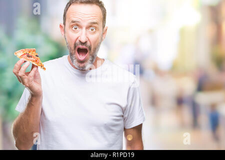 Portrait of excited delivery man in red t-shirt and cap smiling and ...