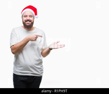 amazed plus size man pointing at tennis racquet and looking at camera ...