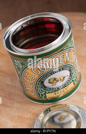 Lyle's Golden Syrup in its distinctive green and gold tin marketed ...