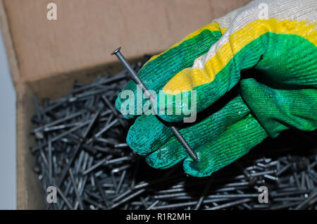 Metal nails for repair in a box for sale Stock Photo - Alamy