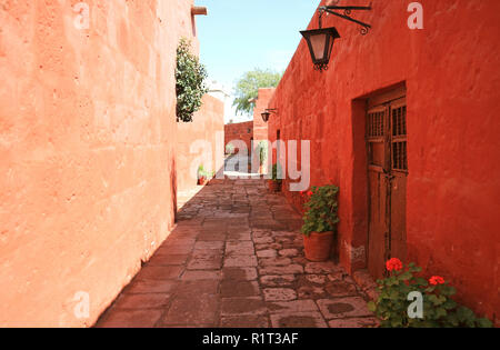 Ancient stone monastery buildings with orange roofs sit precariously on ...