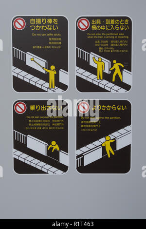 Warning signs in Japan at the train platform. Selfie stick warning sign ...