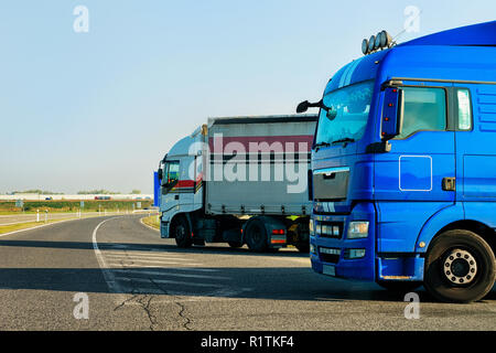 Trucks in the asphalt road in Poland. Lorry transport delivering some ...