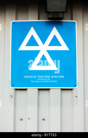 a MOT vehicle inspection station sign on a garage wall, UK Stock Photo ...