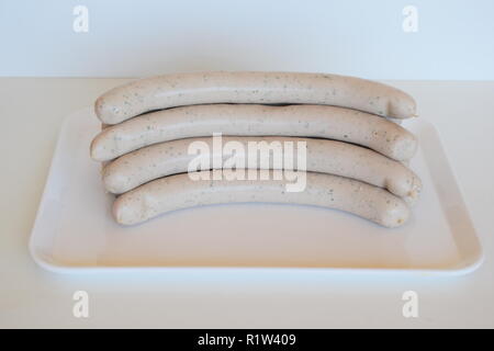 Original German Bratwurst of a white plate. Original deutsche Bratwurst ...