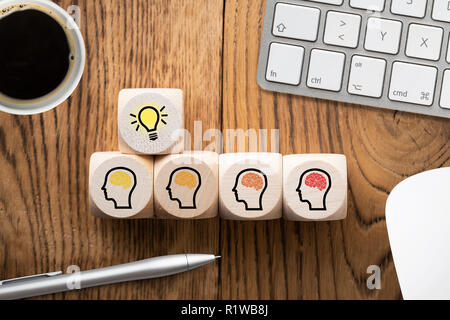 many people together having an idea symbolized by icons on cubes on ...