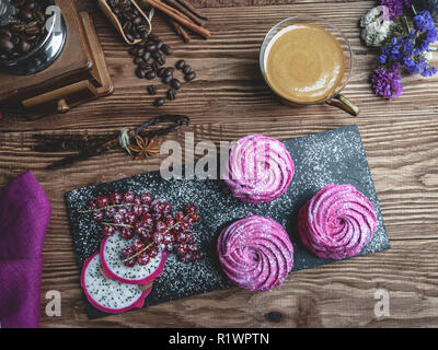 Red currant marshmallow, handmade. A cup of coffee with dessert on the ...