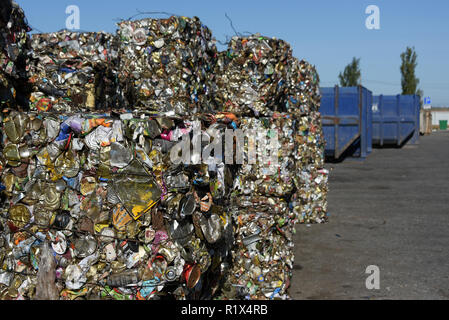 Pressed cubes of cans for recycling at the waste segregation station in ...