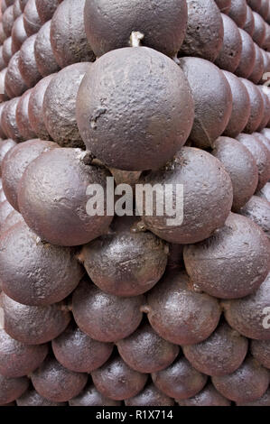 Closeup of ancient and rusty cannon balls, pattern, iron sphere shape ...