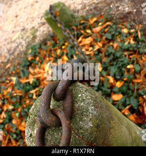 Hanging chain between two posts Stock Photo - Alamy