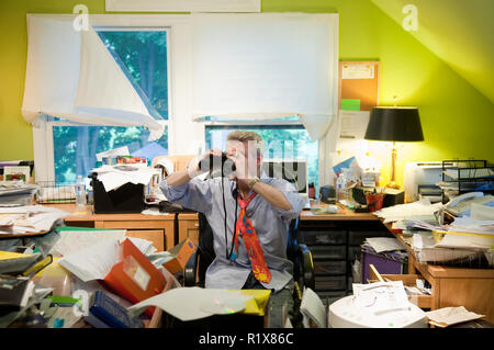 Businessman in Hoarders' Messy Home Office, USA Stock Photo: 72586853 ...