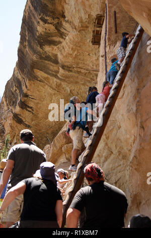tourists climbing up steep ladder up to Balcony House, Cliff dwellings ...