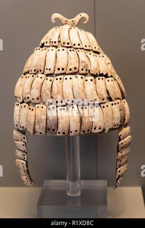 Boar's tusk helmet with cheek guards and double bone hook on top. Tomb ...