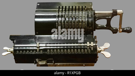 ANTIQUE ROTARY CALCULATOR. Old vintage rotary calculator on isolated ...