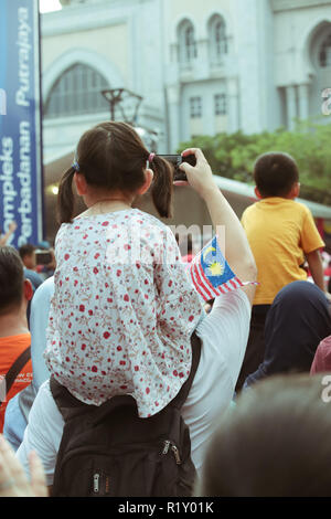 Children shoulder ride their father at Putrajaya during Malaysia ...