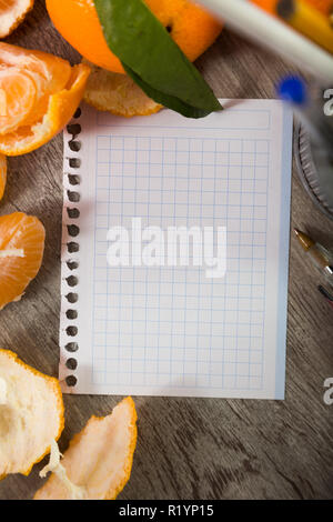 Notebook with writing utensils surrounded by fruit Stock Photo - Alamy