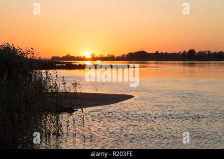 Sunset at the river Oder. Oderbruch, Brandenburg, Germany Stock Photo ...