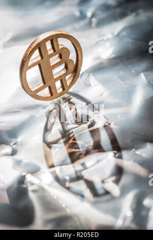 Business and finance concept. Among financial charts and money is a ...