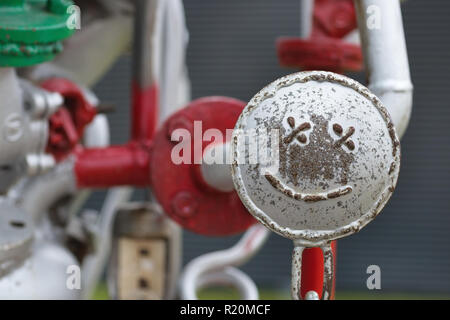 Smiley face on the pipes construction. Easy repairs concept Stock Photo ...