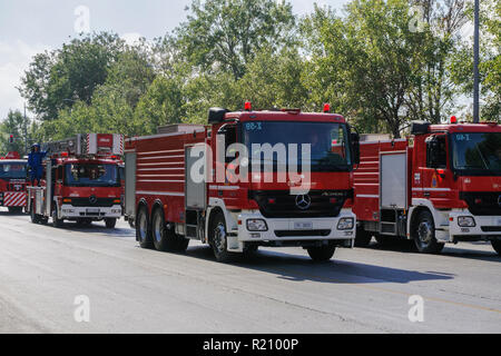 Greek Fire Brigade Service trucks with firefighters in uniform during a ...