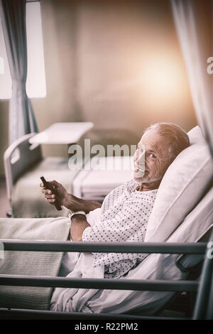 TV remote control on hospital bed Stock Photo - Alamy