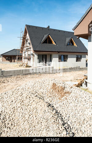 New build houses. Stones heap Stock Photo - Alamy
