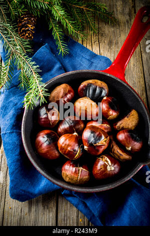 Cracked roasted chestnuts, traditional autumn winter homemade snack, on ...