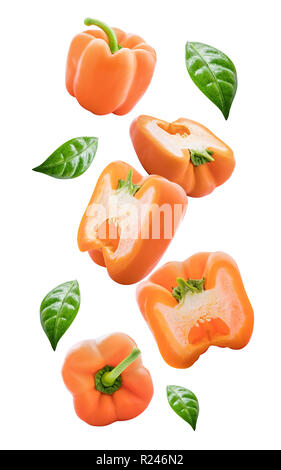 Red, green and yellow peppers. Flying peppers on a white background ...