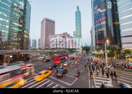 Traffic in front of Taipei 101 at a busy downtown intersection in the ...