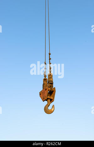Tower crane with steel hook building metal construction Stock Photo - Alamy
