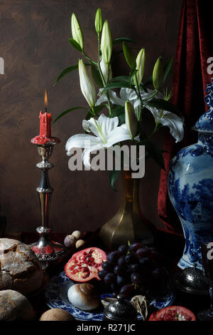 Vanitas still life with a bunch of flowers, a candle, smoking ...