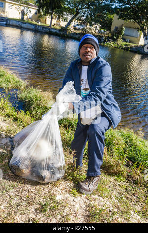 Volunteers pick up the trash in the Los Angeles River during the event ...