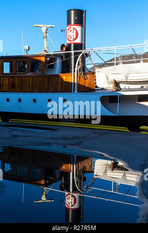 Veteran steamship Granvin in the port of Bergen, Norway. Mount Floyen ...