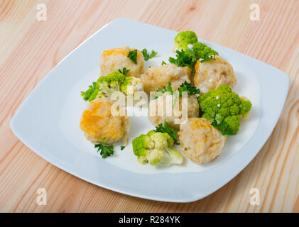 Fish balls of different white fish at plate with brokkoli, dish of ...