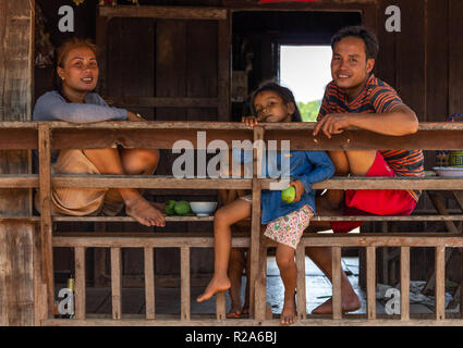 Lao girls in front of their home in Muang Ngoi village in northern Laos ...