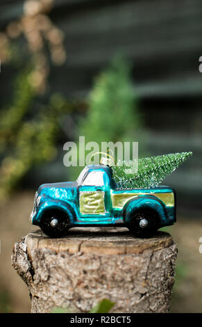Car with christmas tree on stump Stock Photo - Alamy