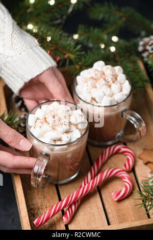 Peppermint hot chocolate with marshmallow and candy cane sweets in ...